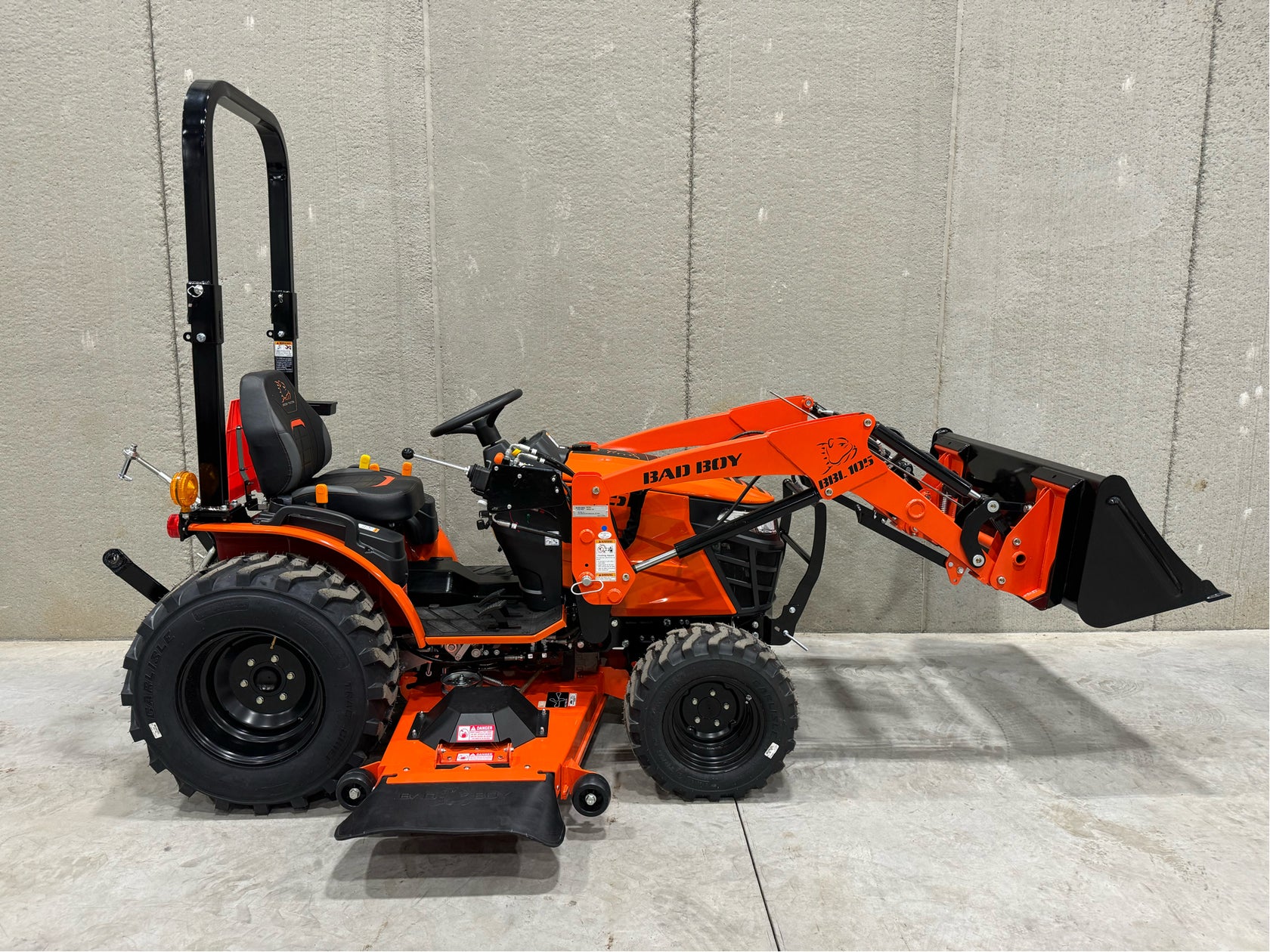 1025H - 10 SERIES, 24 HP W/ 105 LOADER & BELLY MOWER – The Bad Boy Garage